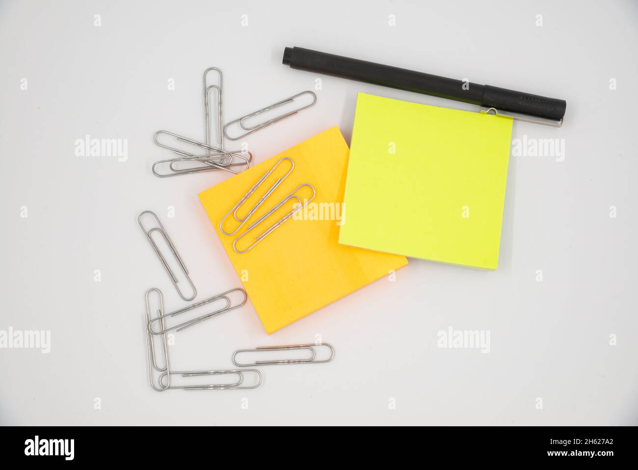 Selective focus of colorful sticky notes and paper clips. Flat lay, top ...