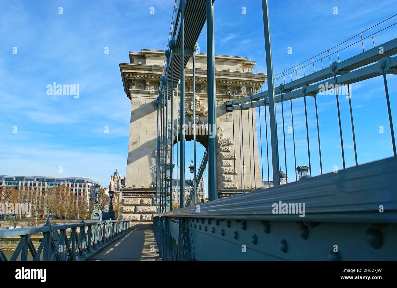 Closeup of the massive metal construction and the carved stone arch of ...