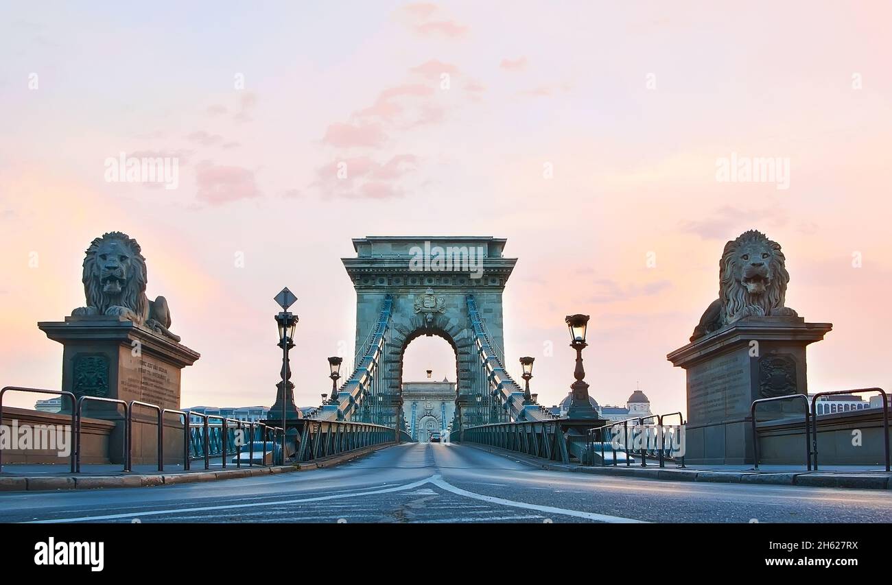 The scenic historic Chain Bridge with carved stone arches, vintage ...