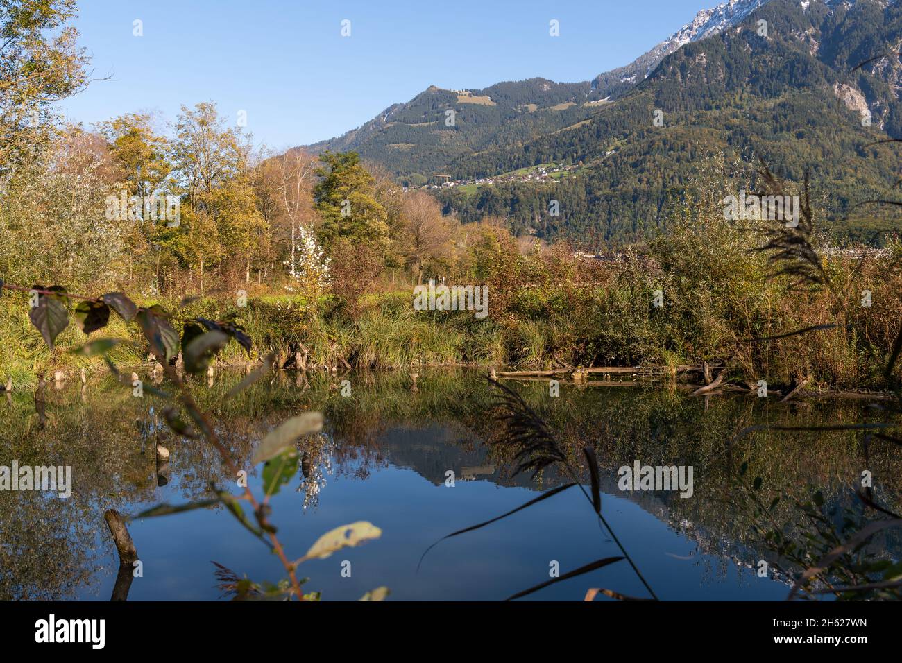 Schaan, Liechtenstein, October 14, 2021 Lovely tiny lake in an alpine ...