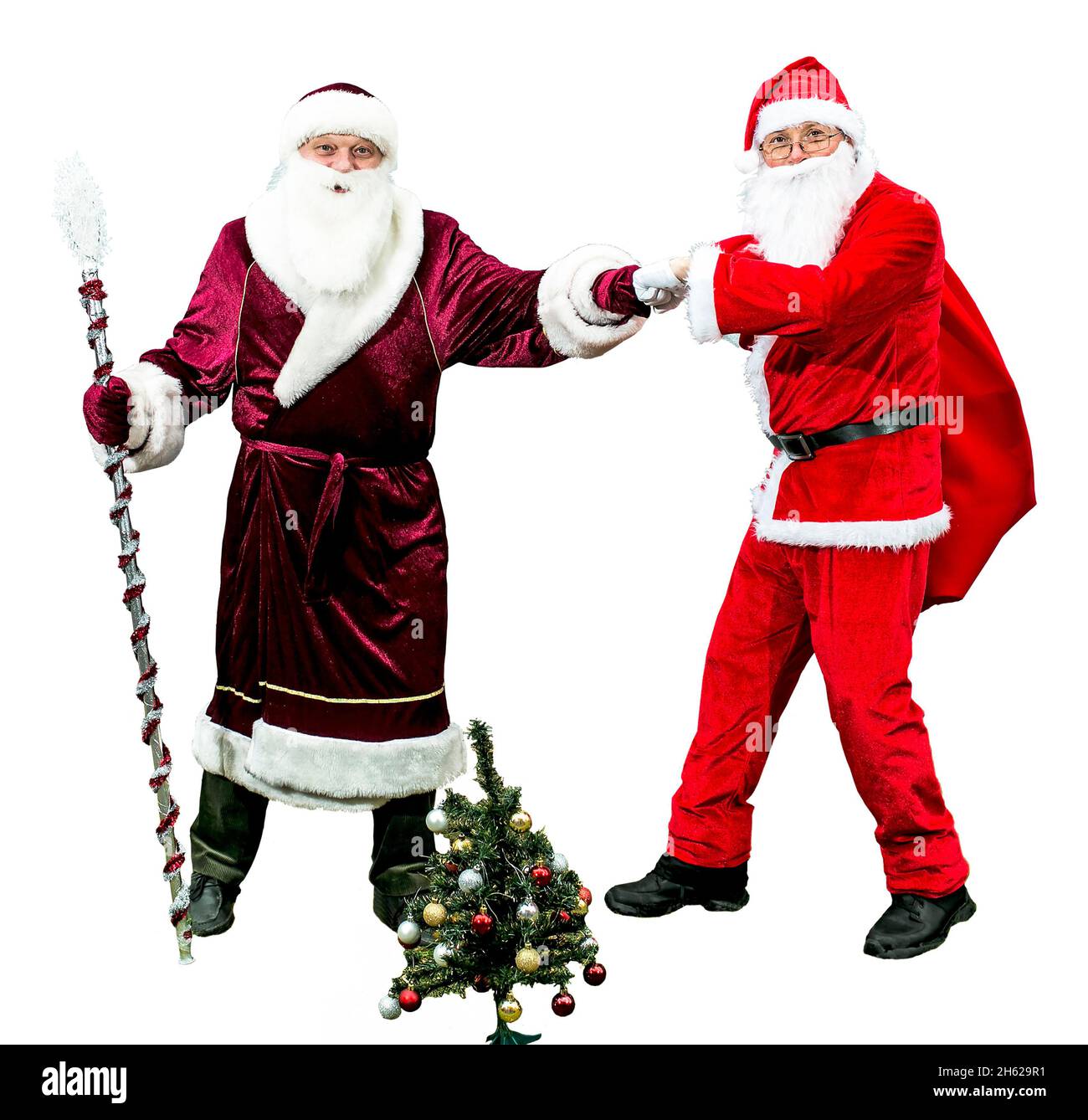 Two cheerful Santa Clauses with a large red bag with gifts and a staff ...