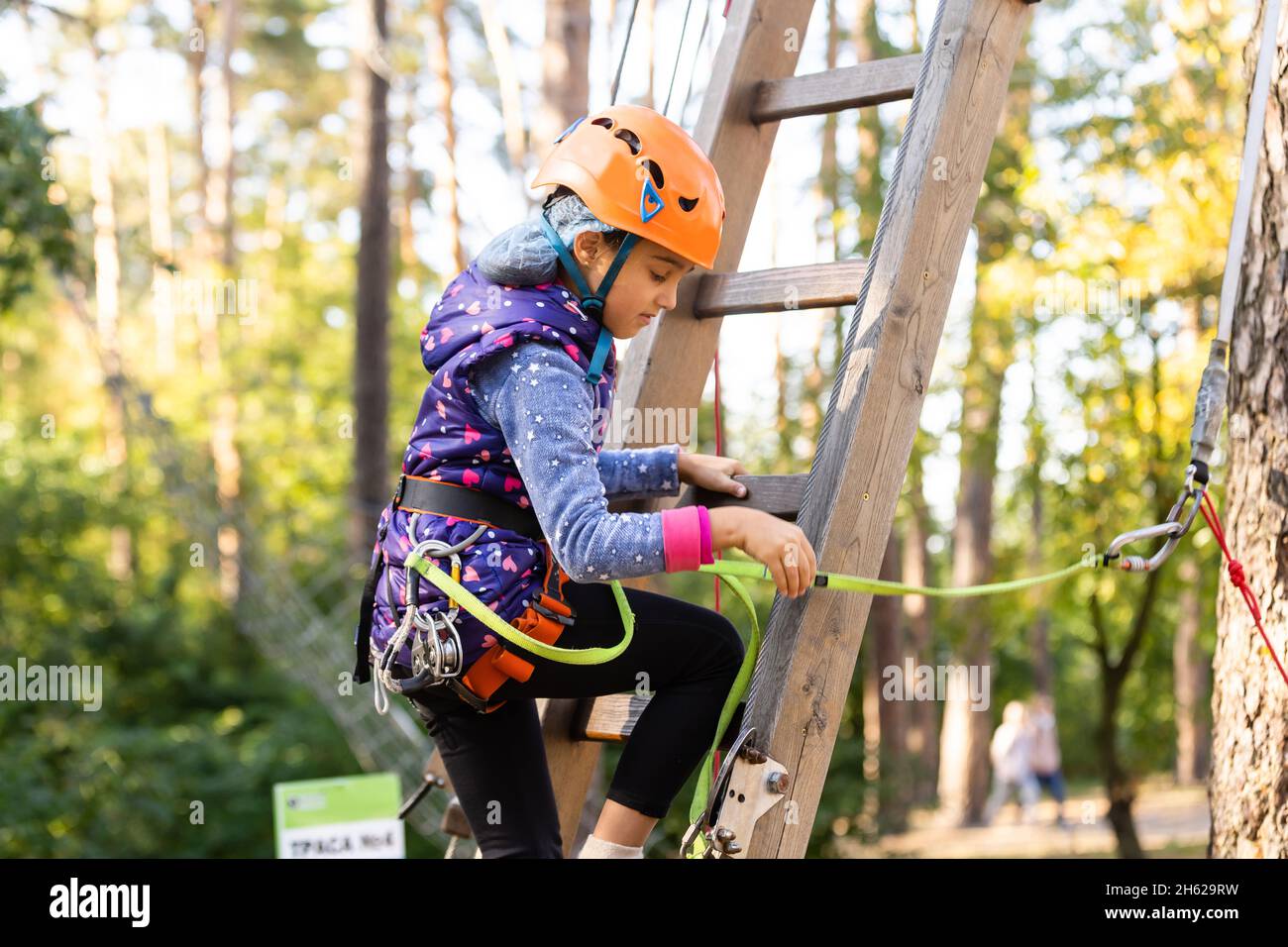 Girl climbing in adventure park is a place which can contain a wide ...