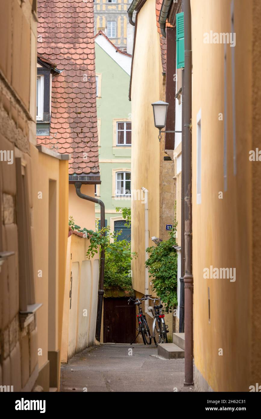 germany,bavaria,upper franconia,bamberg,narrow alley in the old town ...