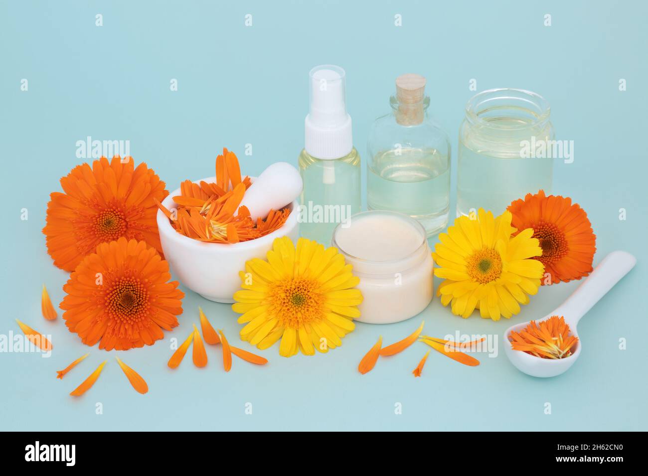 Calendula alternative skincare with flowers, ointment, oil bottles and ...