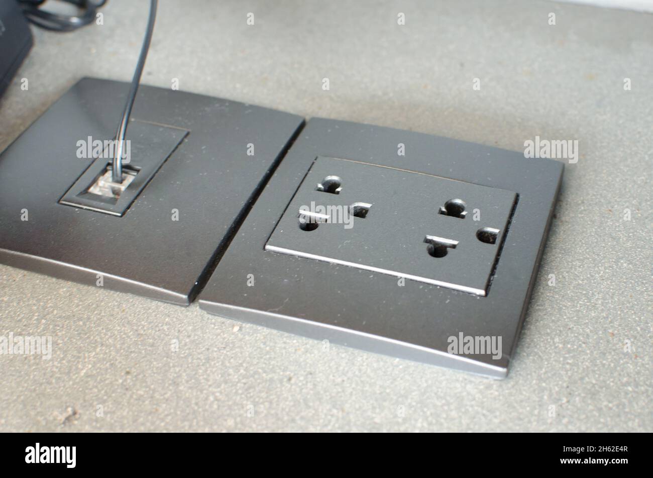 The third eye wall plug Stock Photo - Alamy