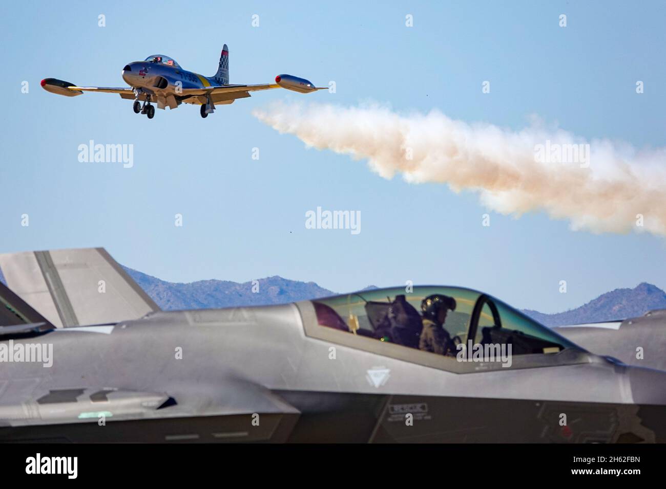 A beautifully restored Lockheed T-33 soars over a F-35 Lightning II at ...