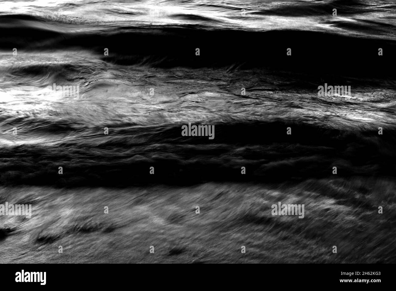 Grayscale shot of water stream in the sunlight Stock Photo - Alamy