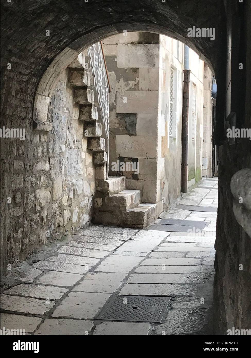 Arch and Stone steps,part diocletian palace, paved street in medieval ...