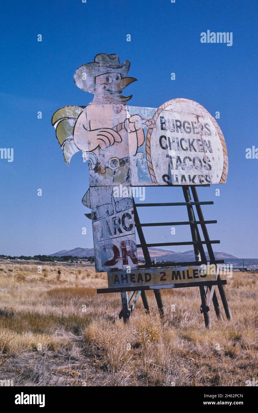 Chicken cowboy billboard wreck, B-80, Elko, Nevada; ca. 1991 Stock ...