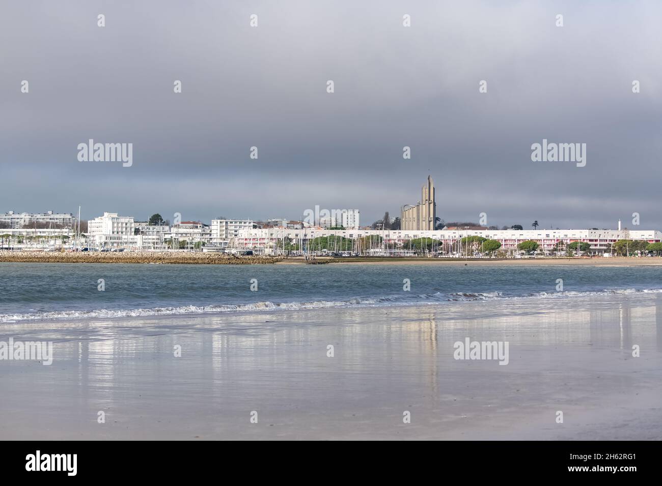 Royan, the beach, with the cathedral in background, with reflection in ...