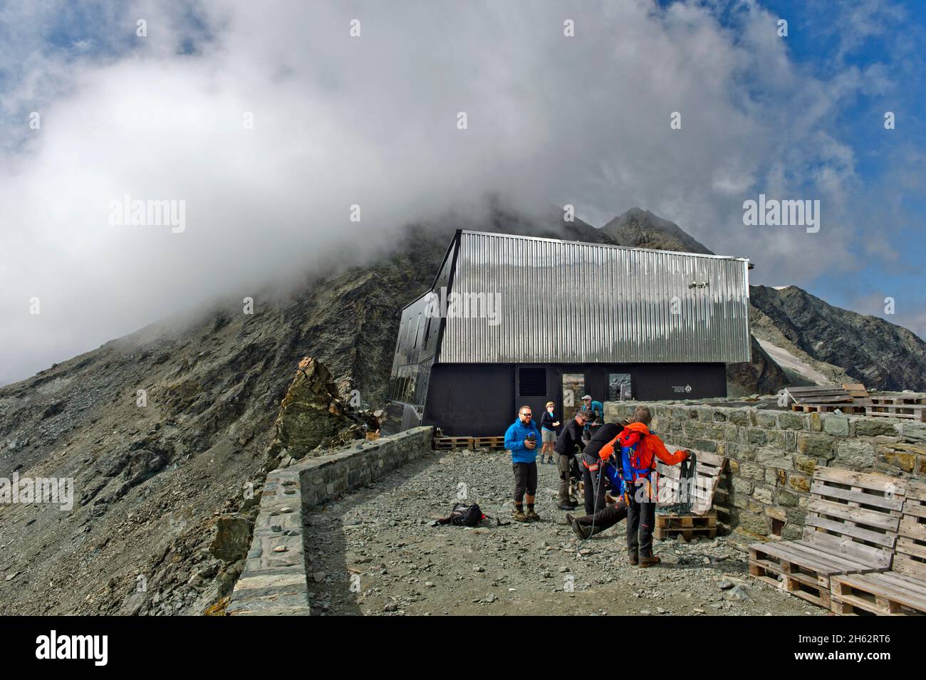 hikers and climbers at the cabane de tracuit mountain hut,zinal,val d ...