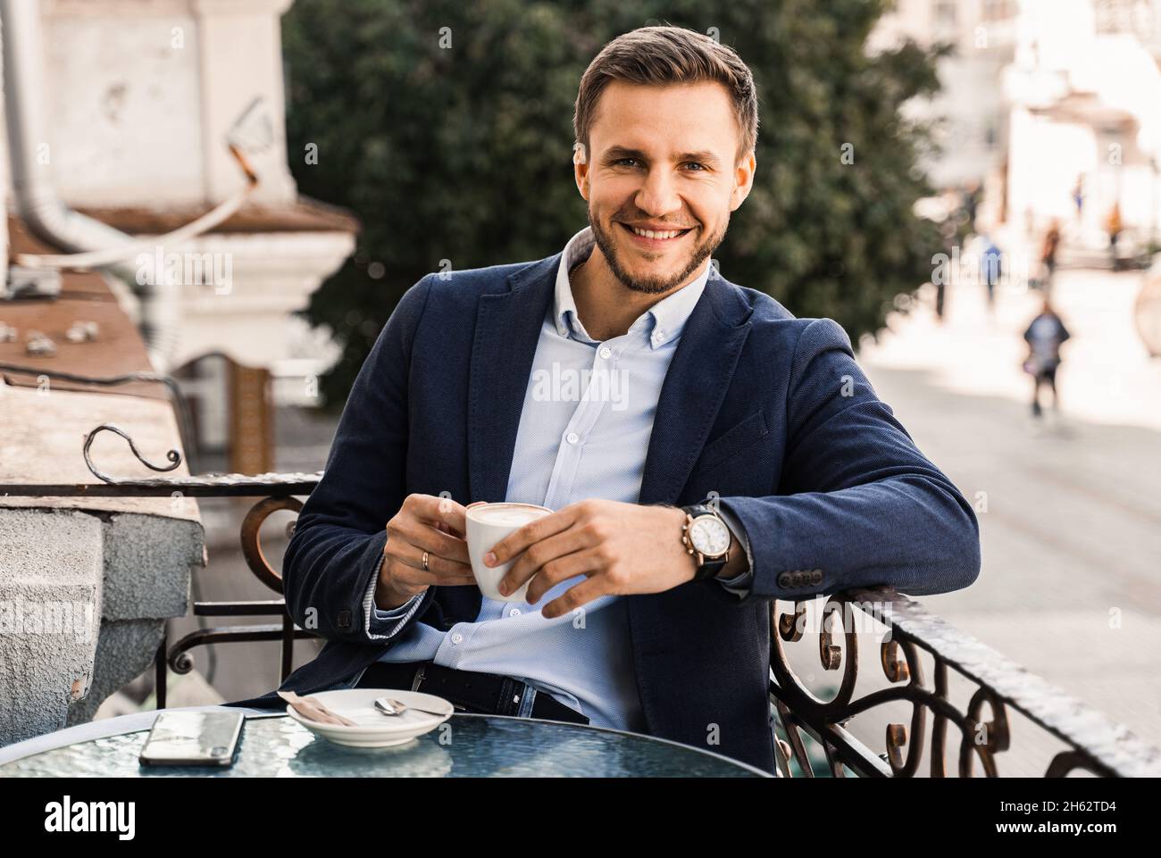 Handsome man with cup of coffee in cafe. Morning lifestyle of male ...