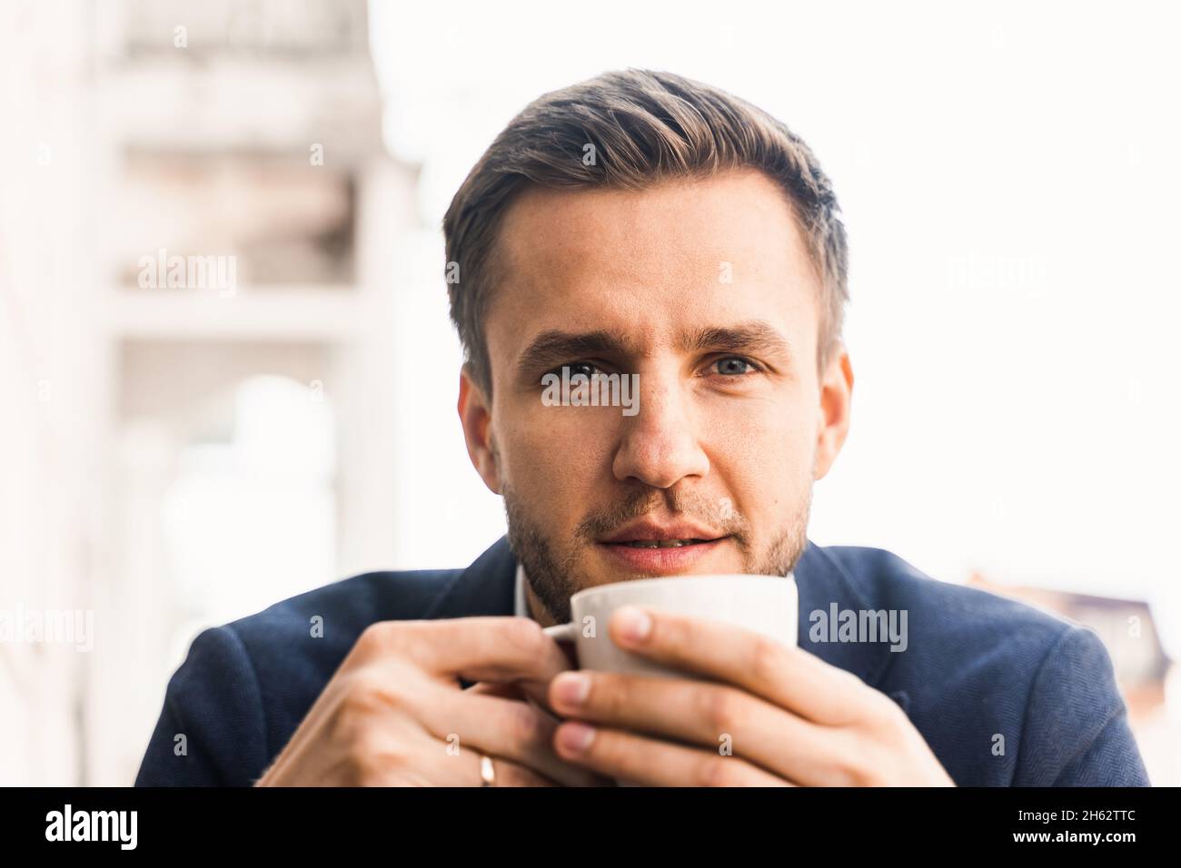 Man like coffee. Handsome man with cup of coffee in cafe. Morning ...