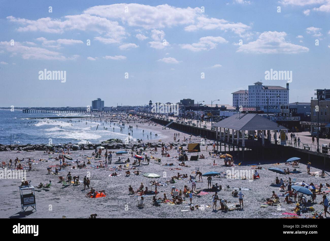 Beach, boardwalk to west, Ocean City, New Jersey; ca. 1978 Stock Photo ...