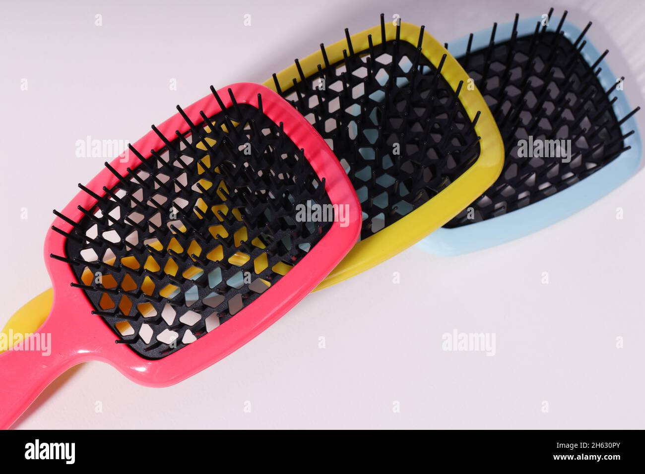 Multi-colored hair combs on an isolated white background Stock Photo ...