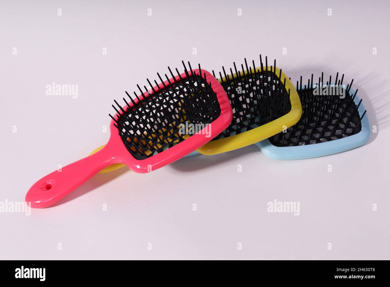 Multi-colored hair combs on an isolated white background Stock Photo ...