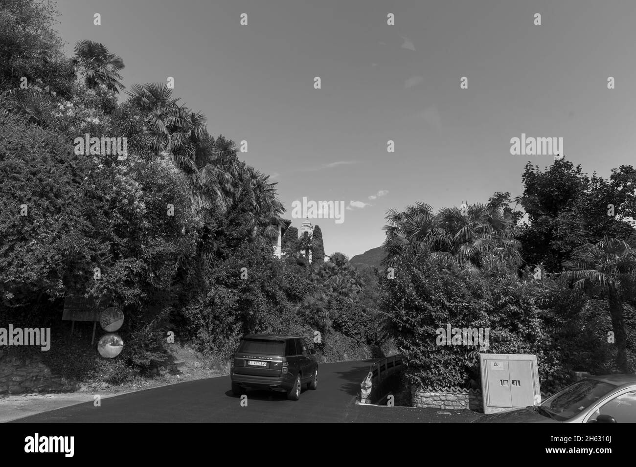 Car on residential road Black and White Stock Photos & Images - Alamy