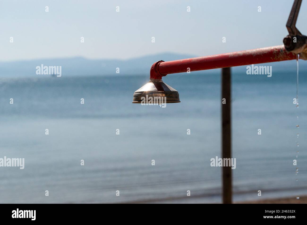 a shower with running water in front of the blue ocean Stock Photo - Alamy