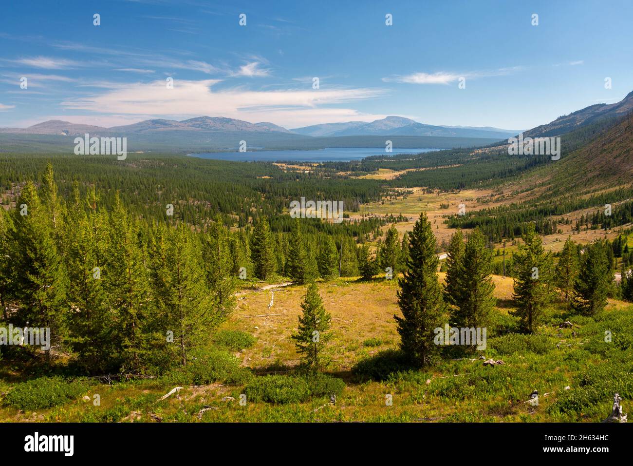 Heart Lake nestled below the base of Mount Sheridan and the Absaroka ...