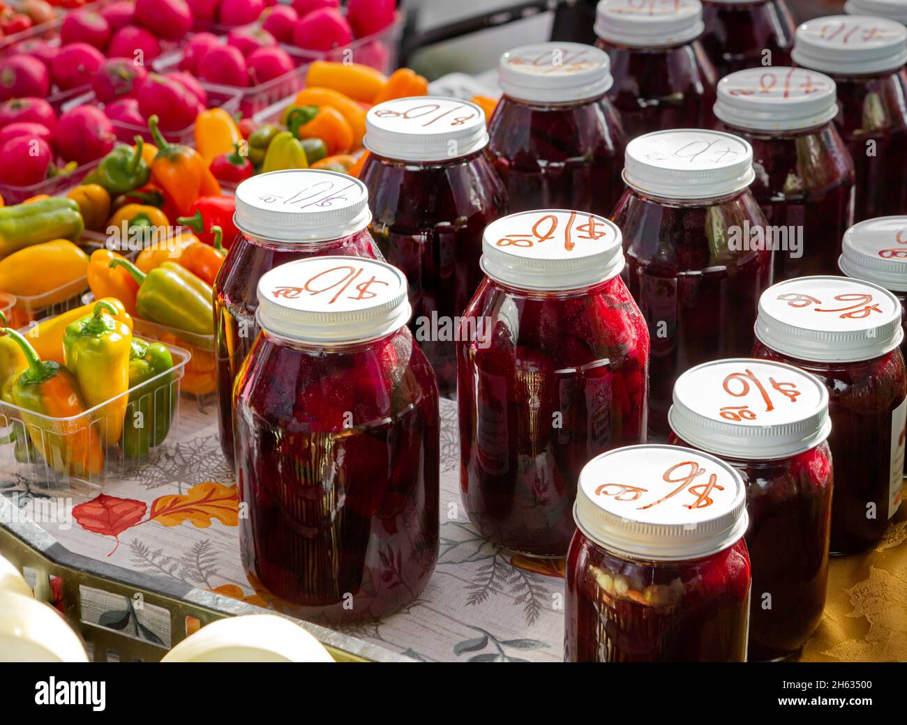 Display of homemade canned beets in quart sized glass jars for sale at ...