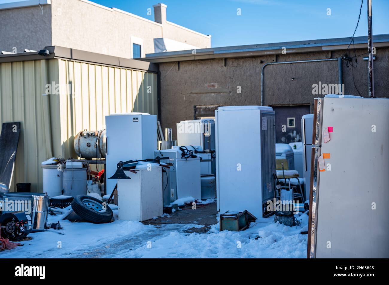 Back alley appliance stockpile of junk for garbage, parts for repair ...