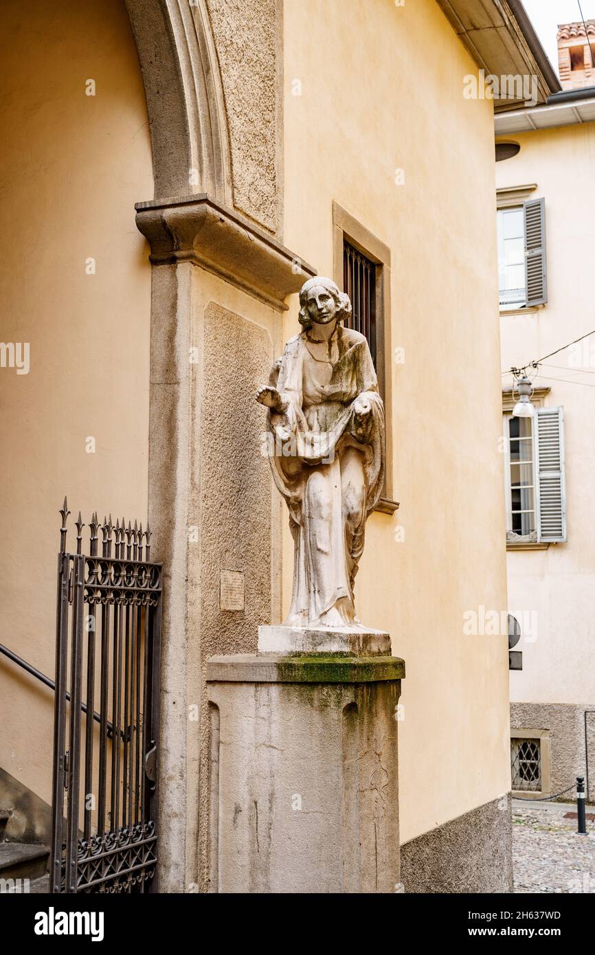 Statue of an angel on a pedestal at the gate. Bergamo, Italy Stock ...