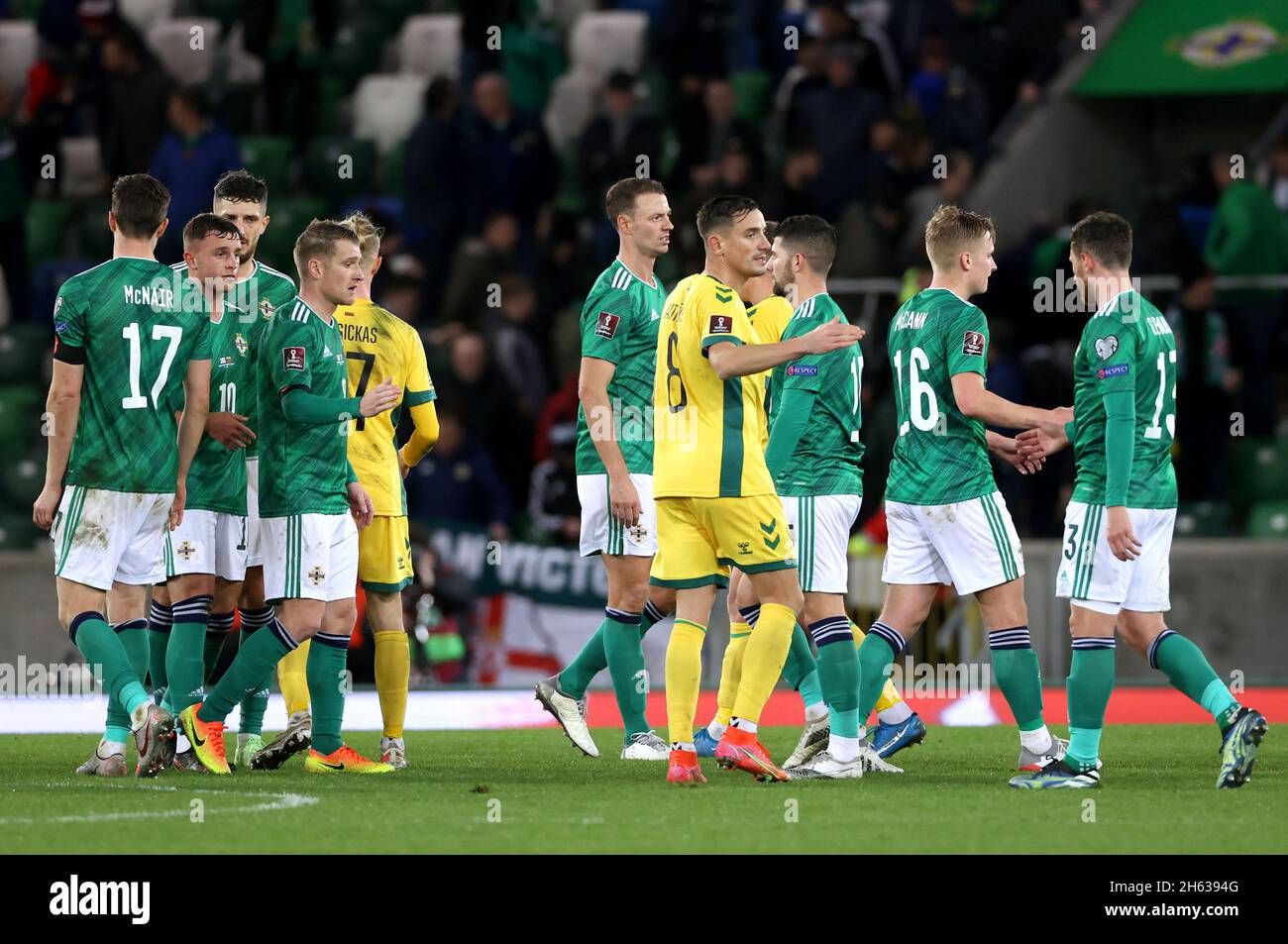 Players shake hands at the end of the FIFA World Cup Qualifying match ...