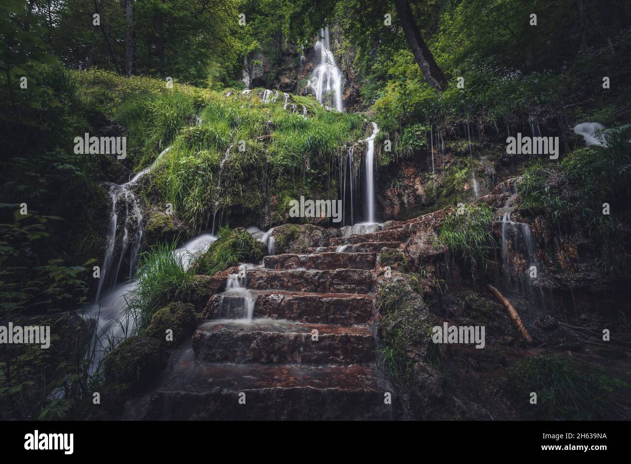 urach waterfall,bad urach,water flows over the stairs Stock Photo - Alamy