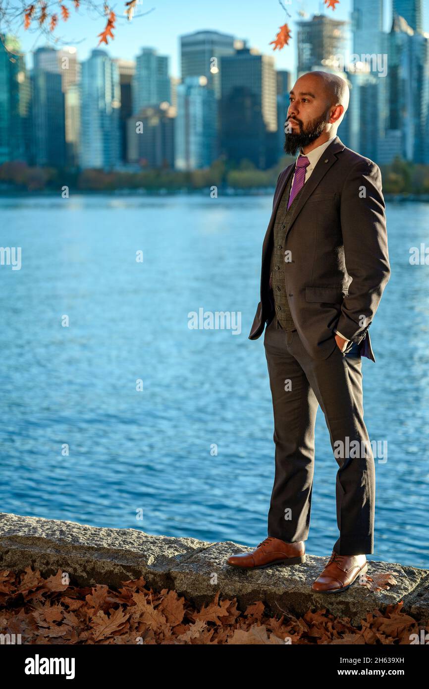 Full length photo of a young successful businessman standing tall ...