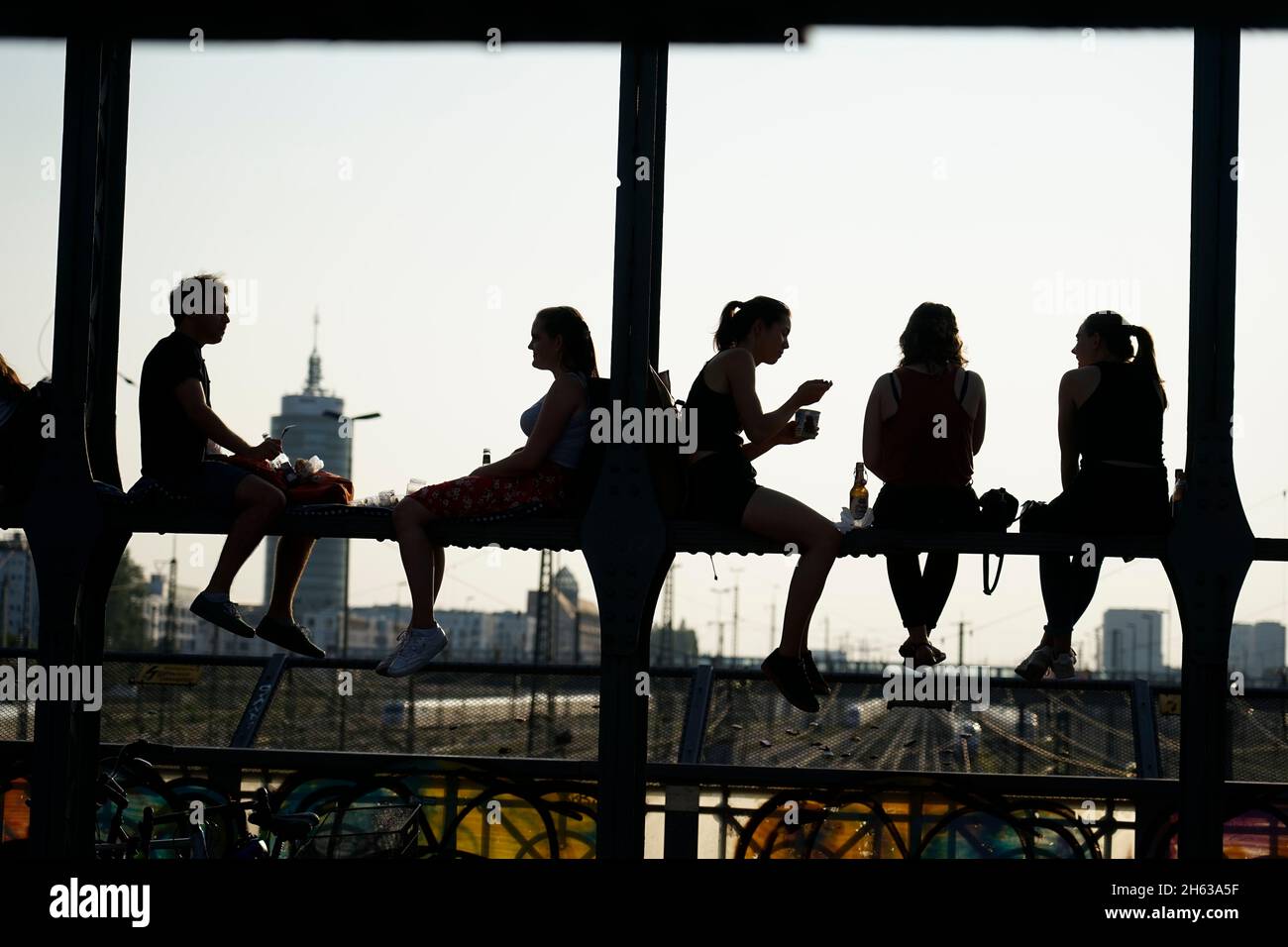 Young people sitting on the iron structure hi-res stock photography and ...