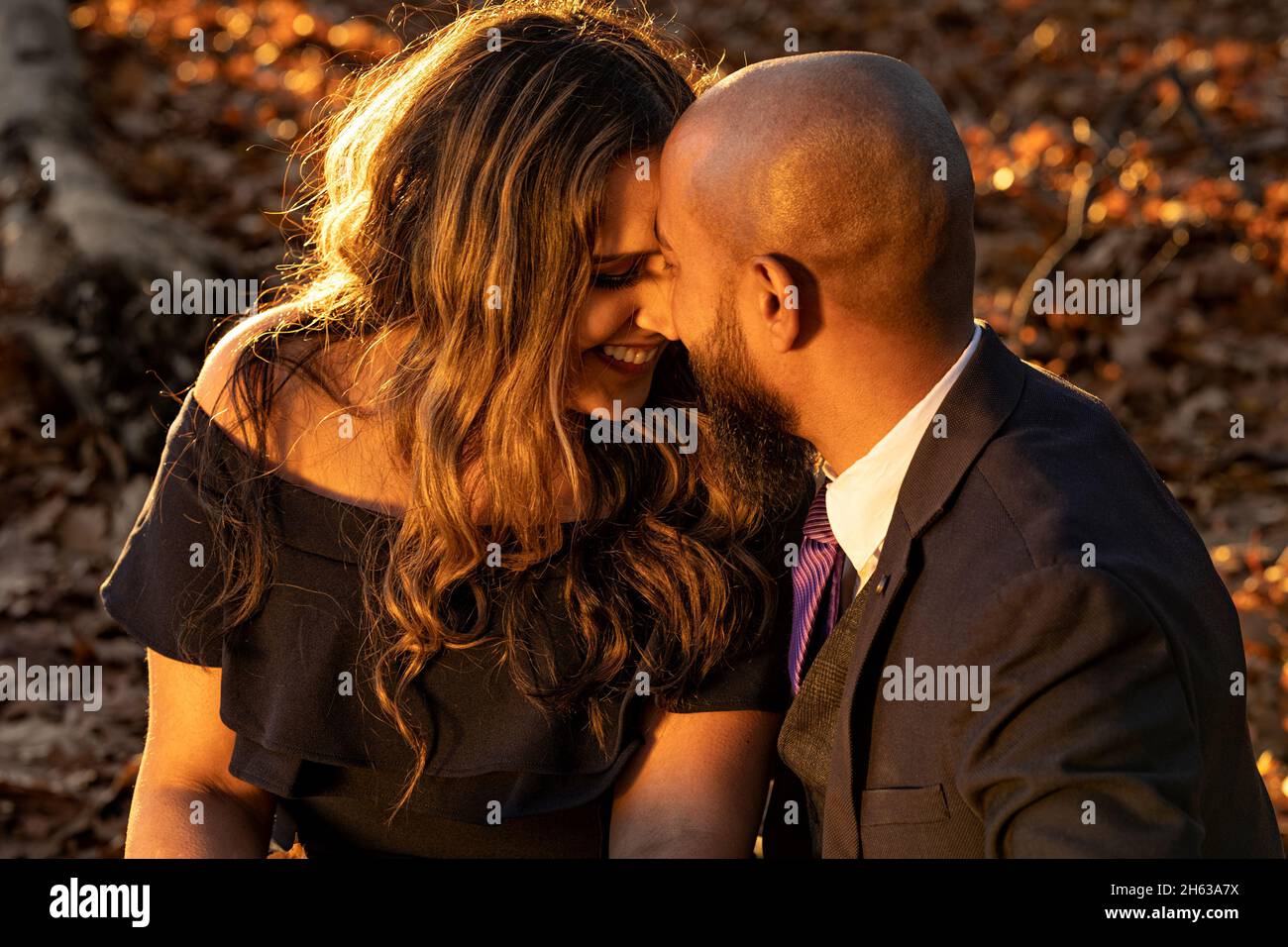 Emotional, full of love photo of a well dressed mixed race couple ...
