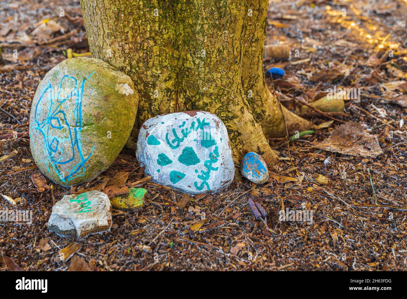 Painted stone with happy messages hi-res stock photography and images ...