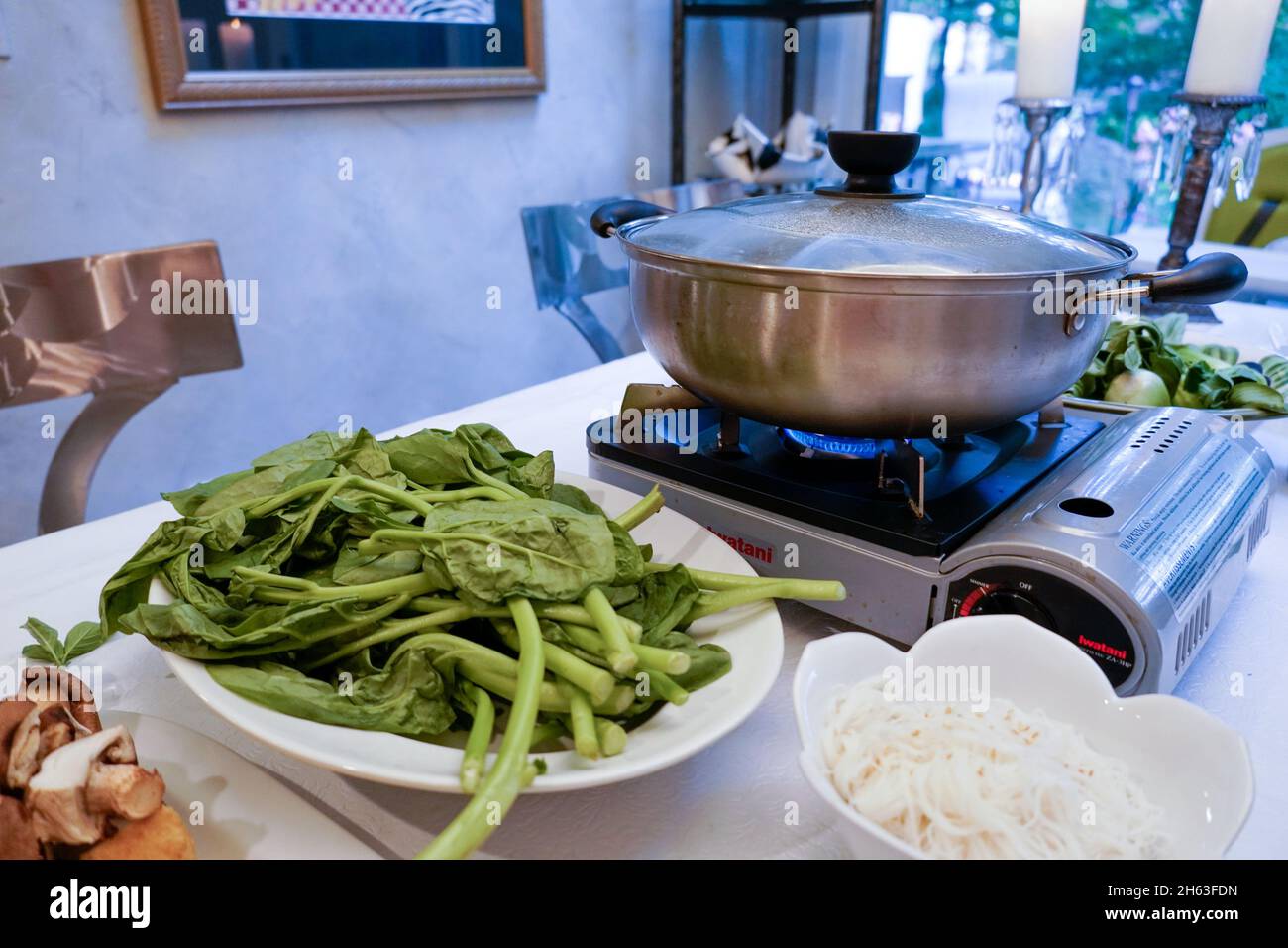 Chinese Cuisine hot pot (hotpot) along with various vegetables and ...