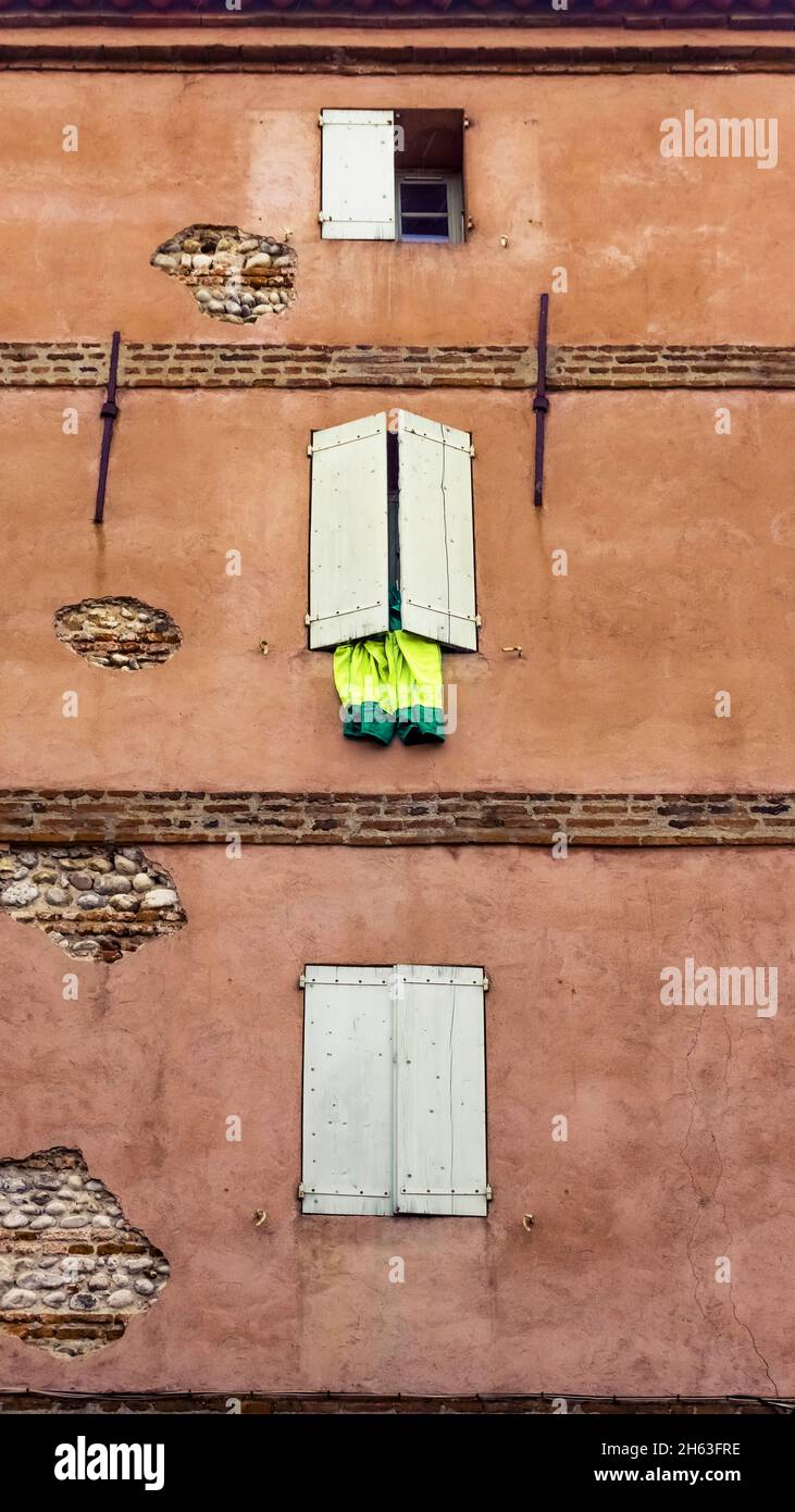 laundry drying at the window in perpignan Stock Photo - Alamy