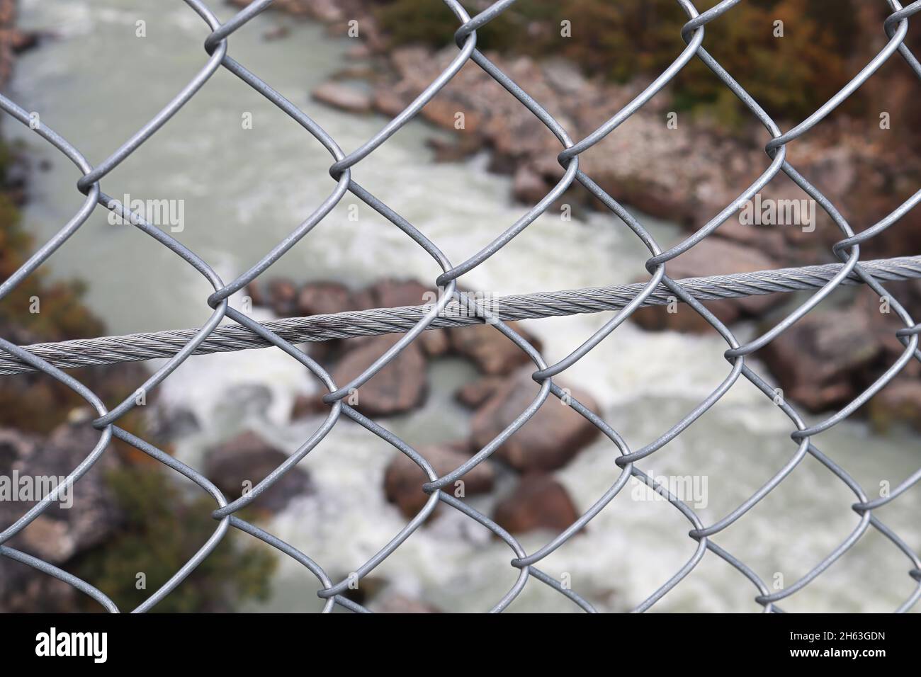 River through fence hi-res stock photography and images - Alamy