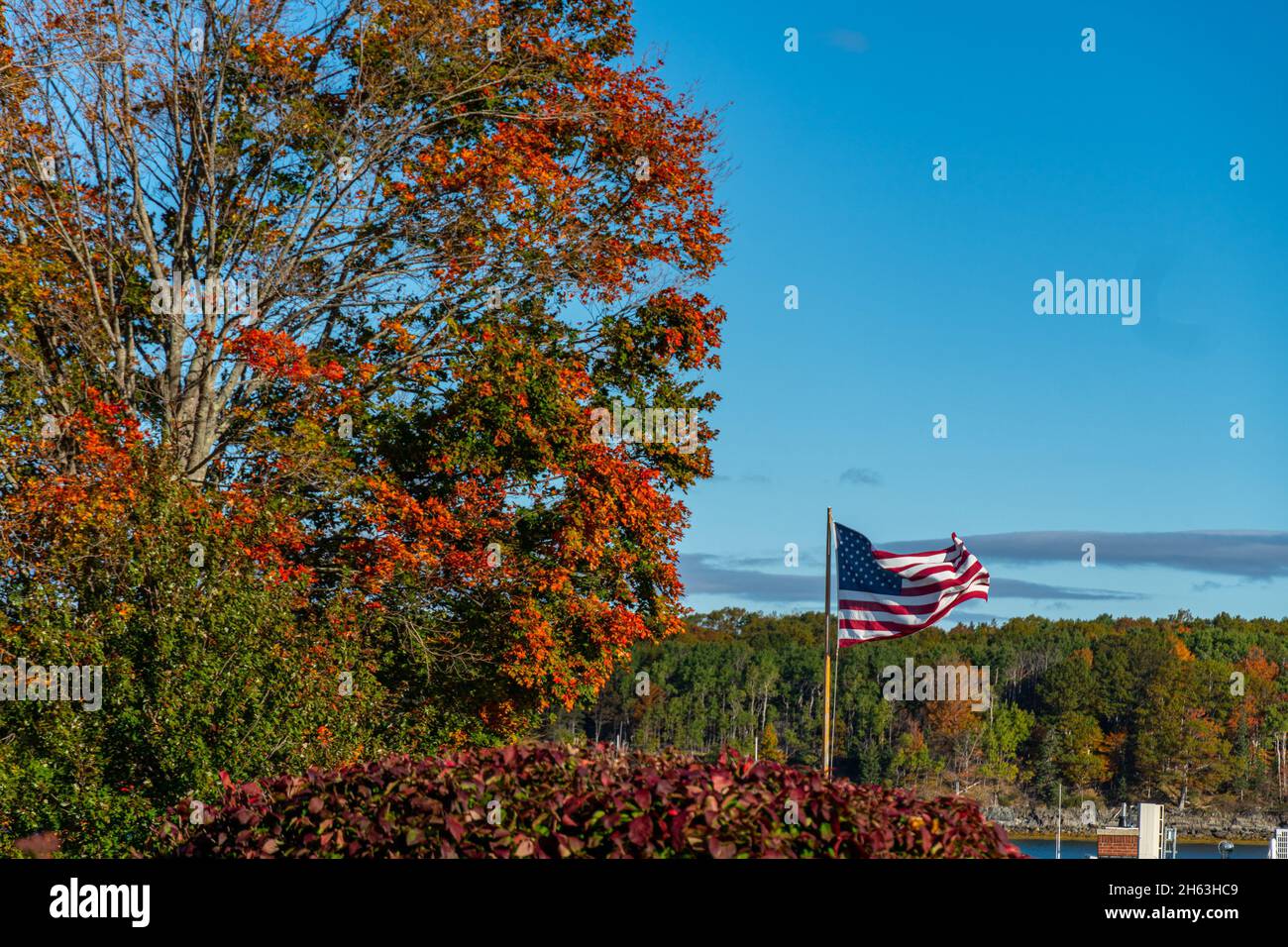 Autumn colors in America with United states flag waving in air Stock ...