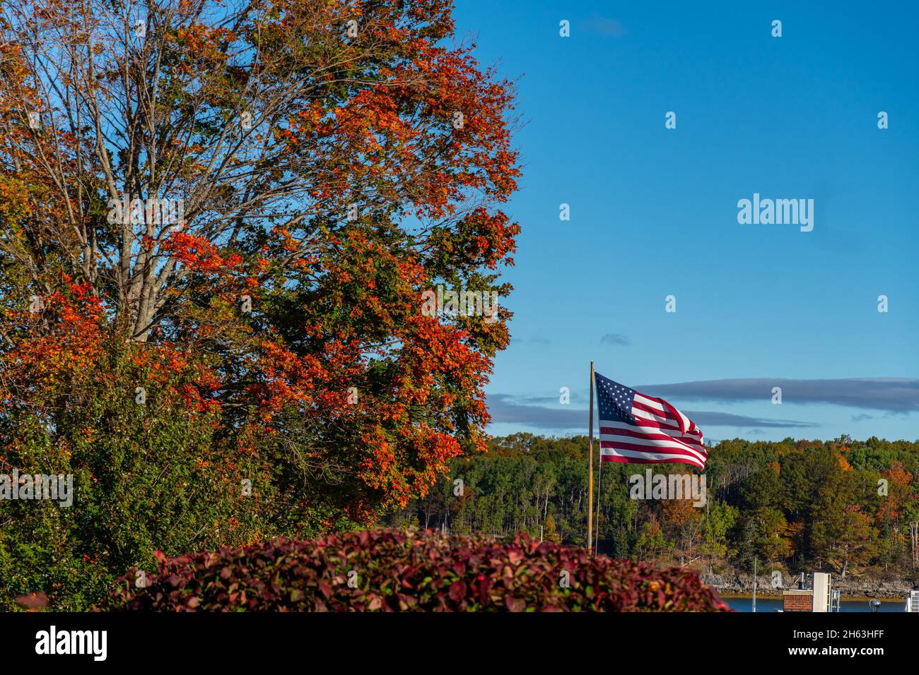 Autumn colors in America with United states flag waving in air Stock ...