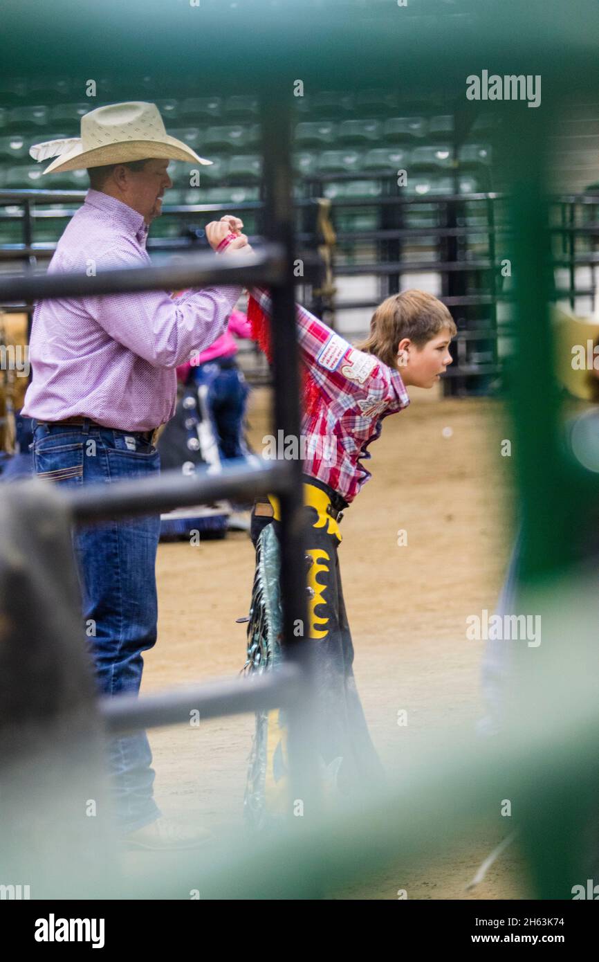 Reno, United States. 11th Nov, 2021. A young bull rider is being ...