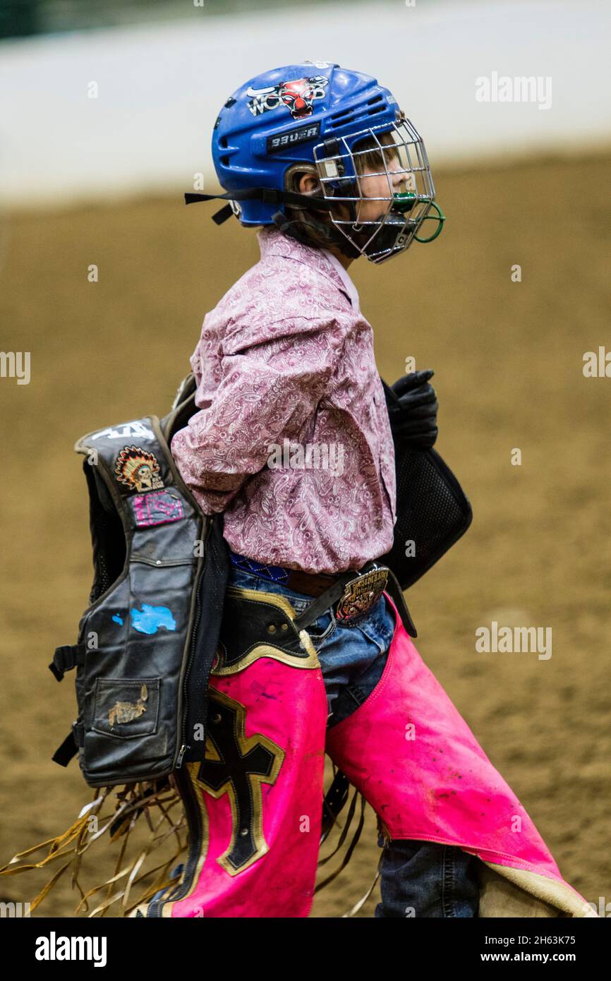 Reno, United States. 11th Nov, 2021. A young bull rider runs back to ...