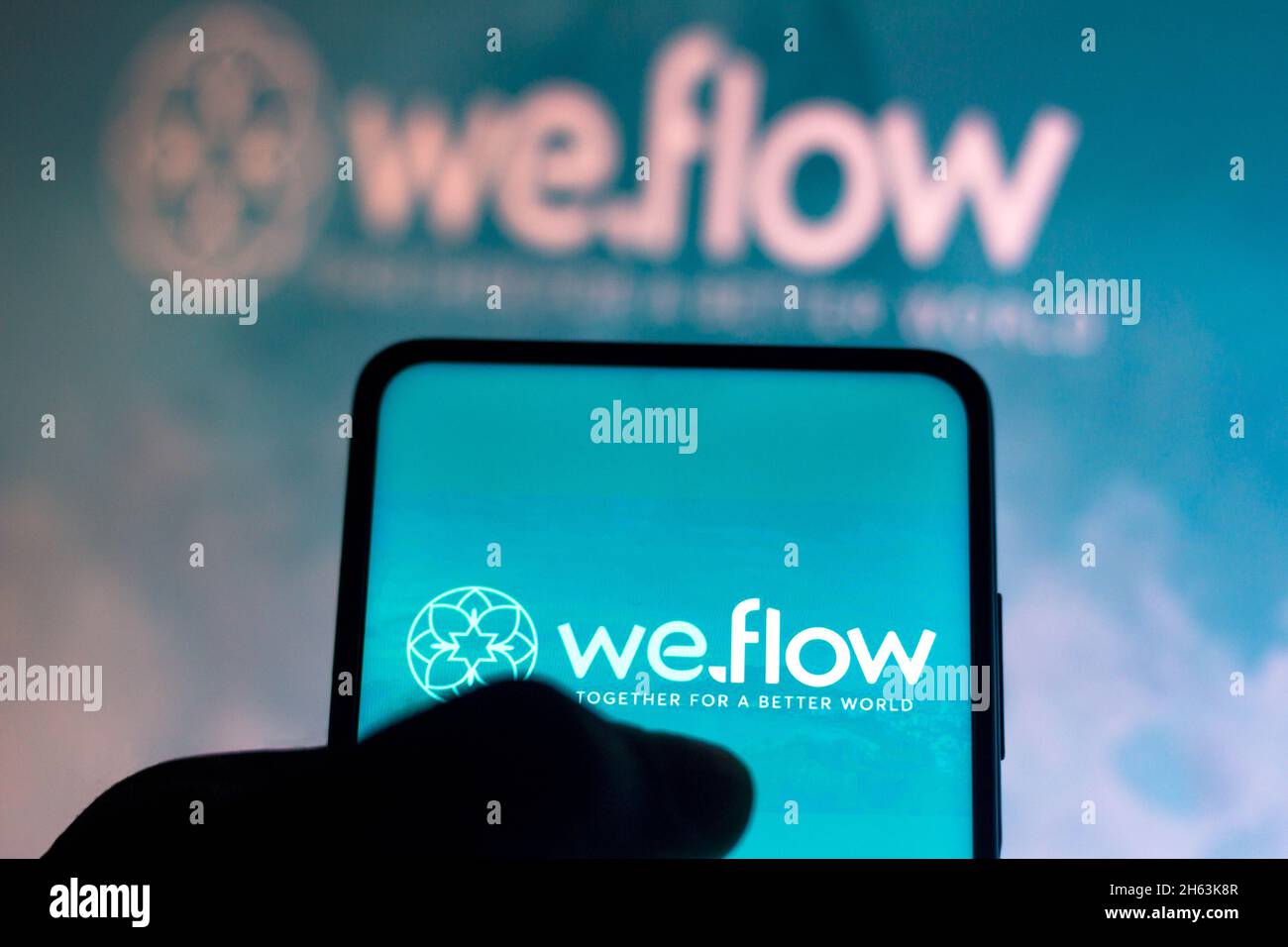 In this photo illustration a We.Flow logo seen displayed on a ...