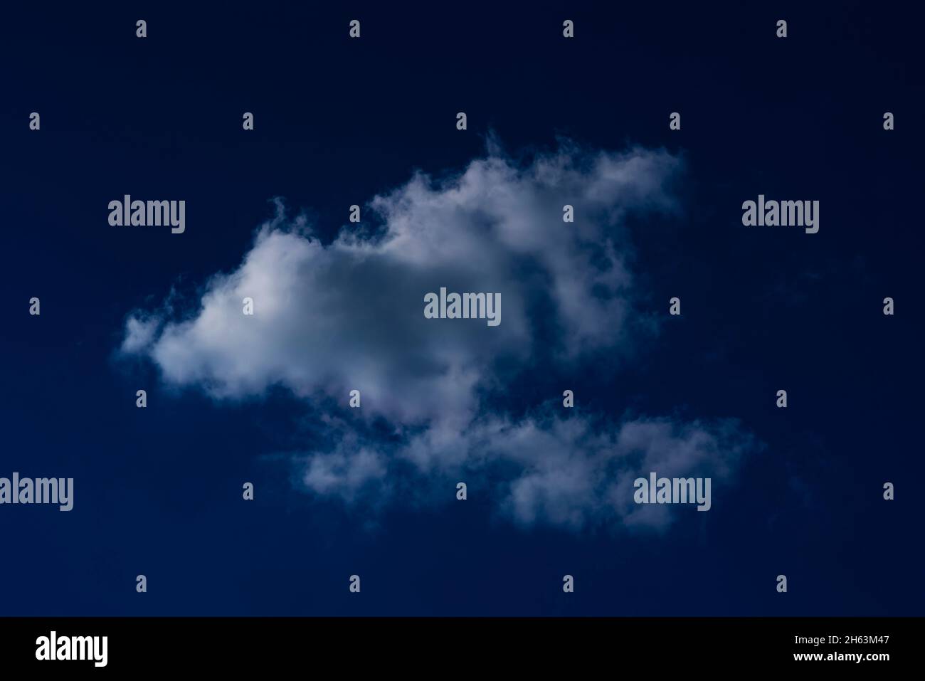 small rain clouds in the sky,bright blue sky in the background Stock ...