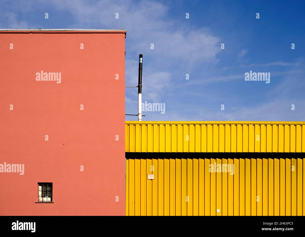 warehouse with red and yellow wall Stock Photo - Alamy