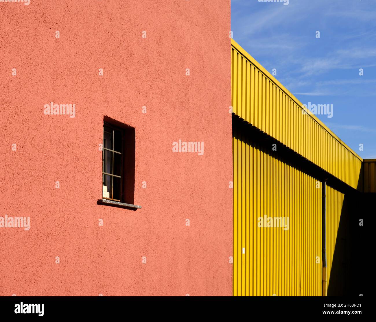 warehouse with red and yellow wall Stock Photo - Alamy