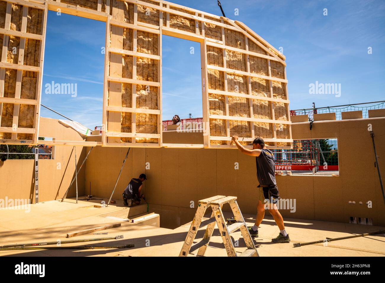 germany,bavaria,construction of a prefabricated wooden house ...