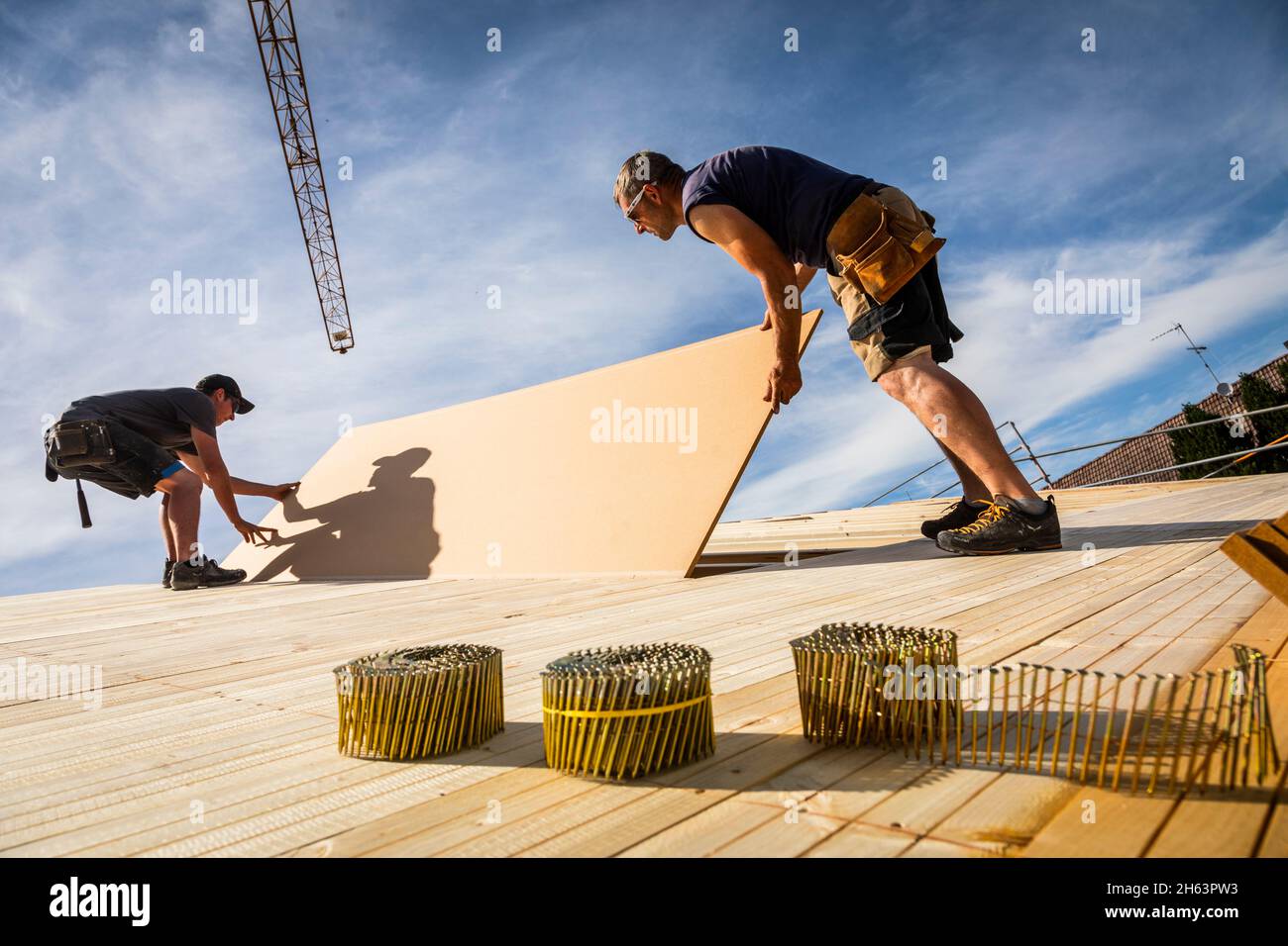 germany,bavaria,construction of a prefabricated wooden house,roof ...