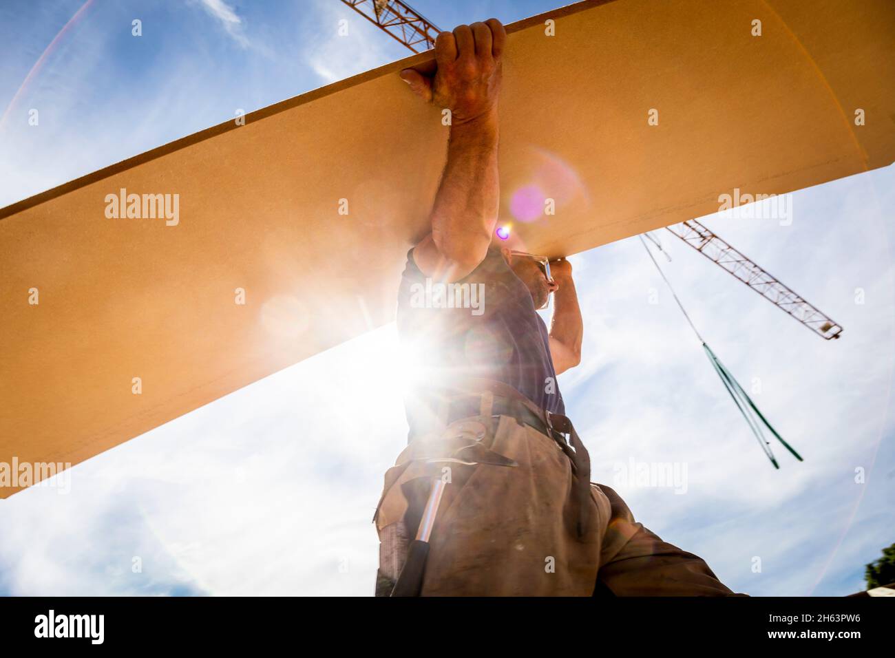 Man working on house roof hi-res stock photography and images - Alamy