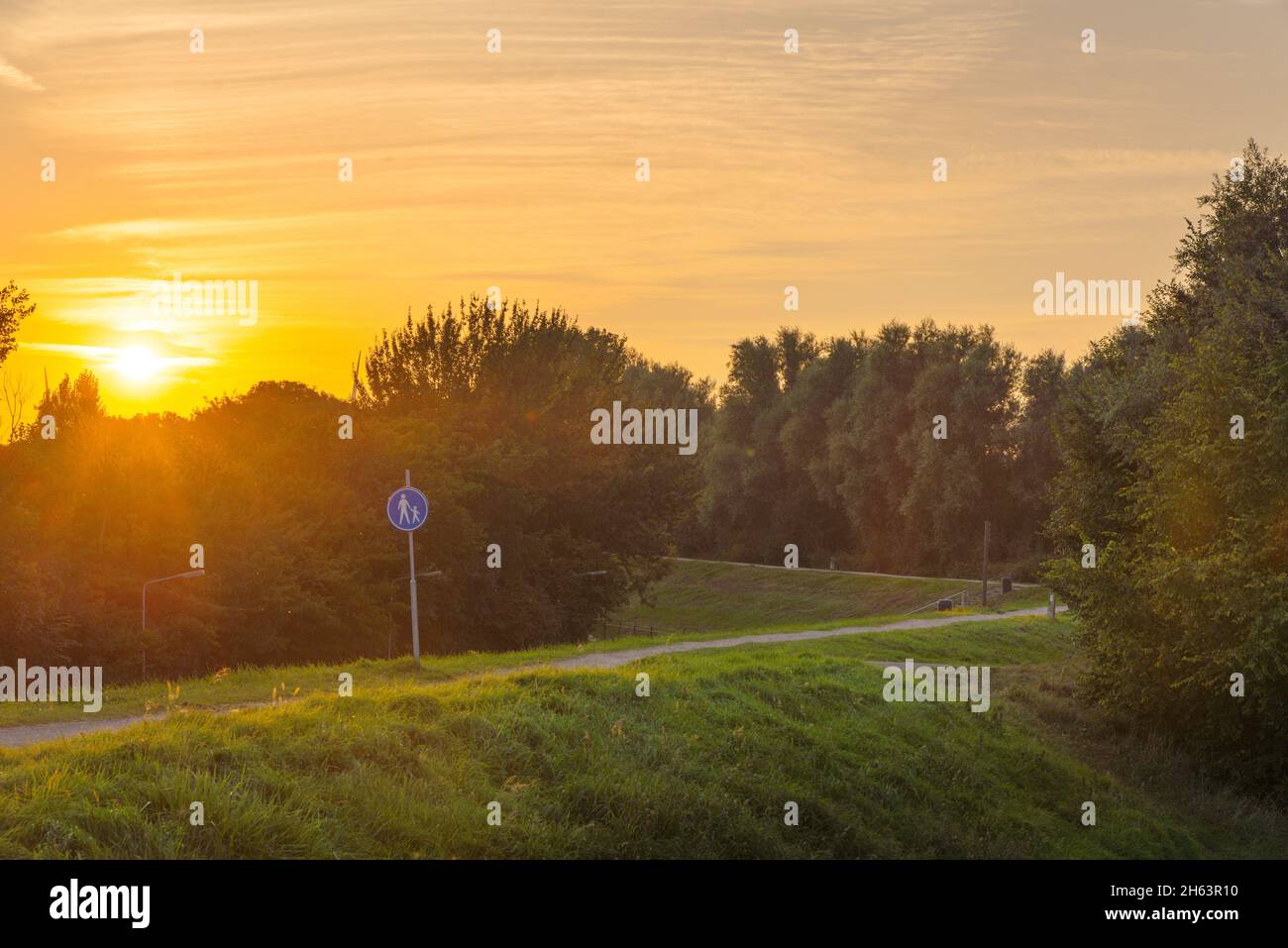 pedestrian path on a dike near kamperland at sunset Stock Photo - Alamy