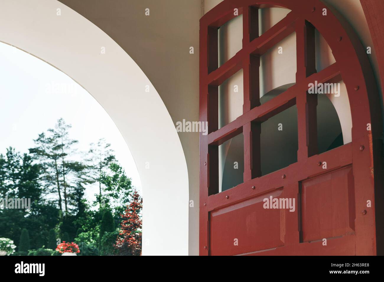 Arch with wooden gate . Church entry Stock Photo - Alamy