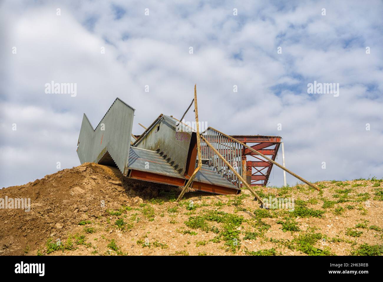 steel stairs on a mound of earth Stock Photo - Alamy
