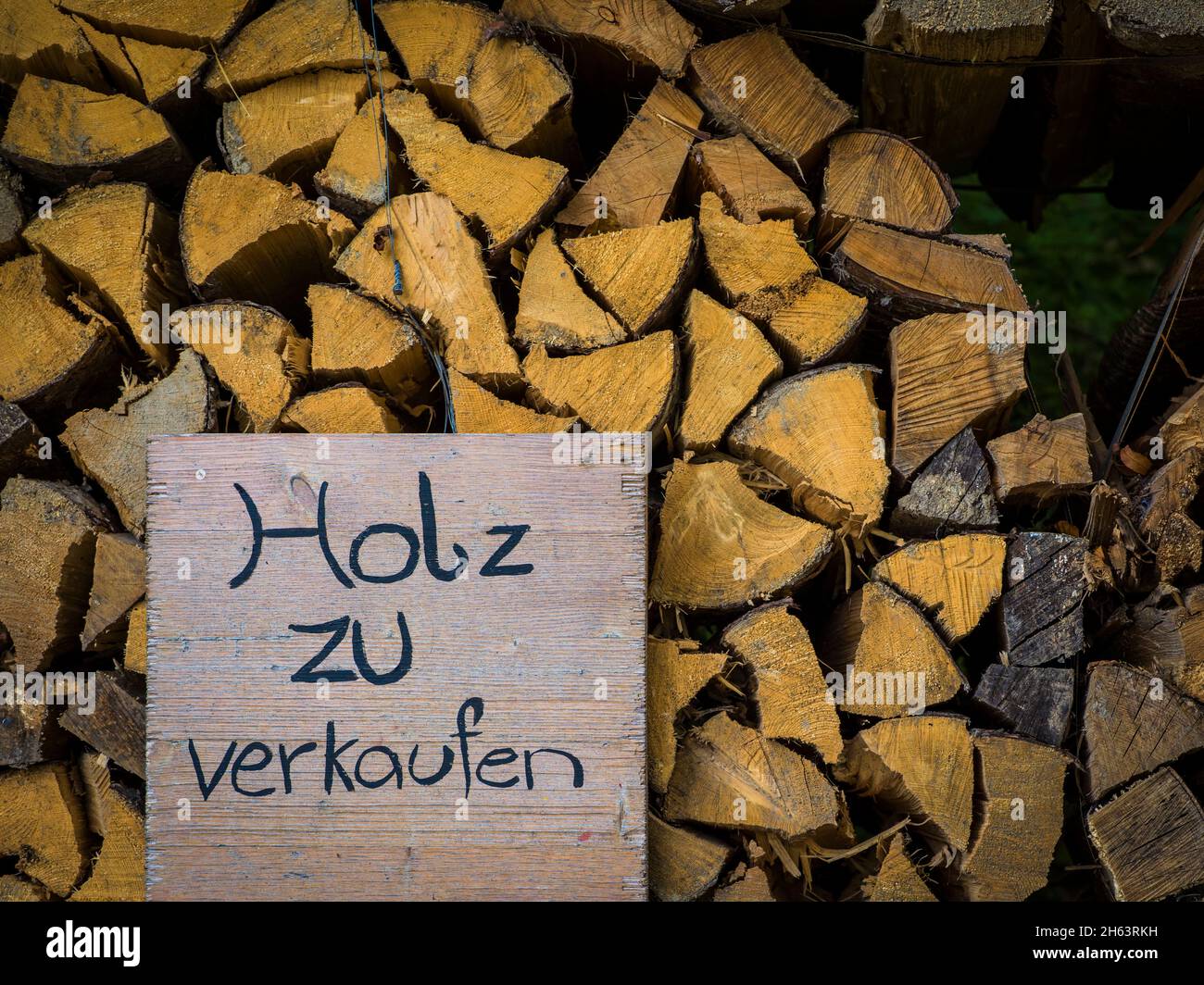stack of firewood,sign,wood for sale Stock Photo - Alamy